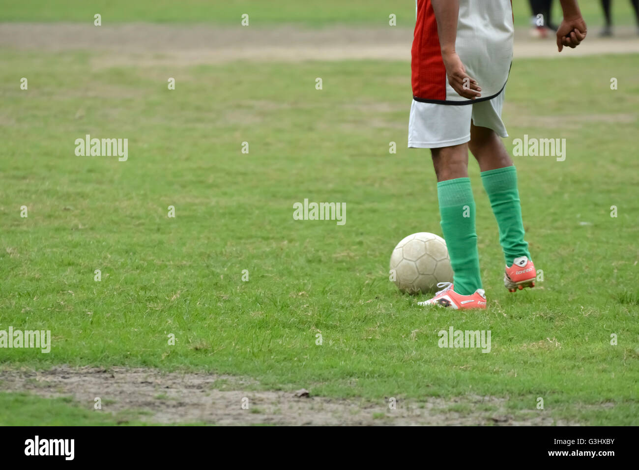 A soccer player is playing a soccer game Stock Photo - Alamy