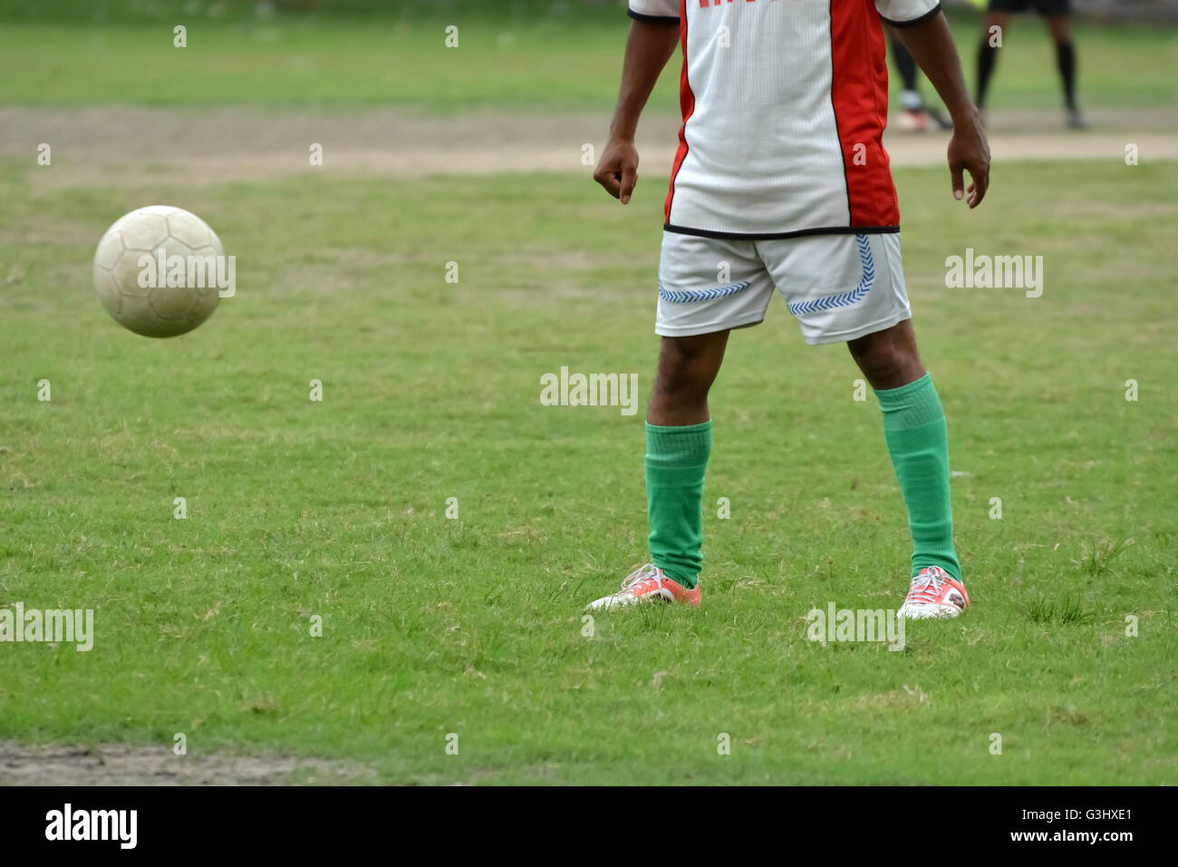 A soccer player is playing a soccer game Stock Photo - Alamy