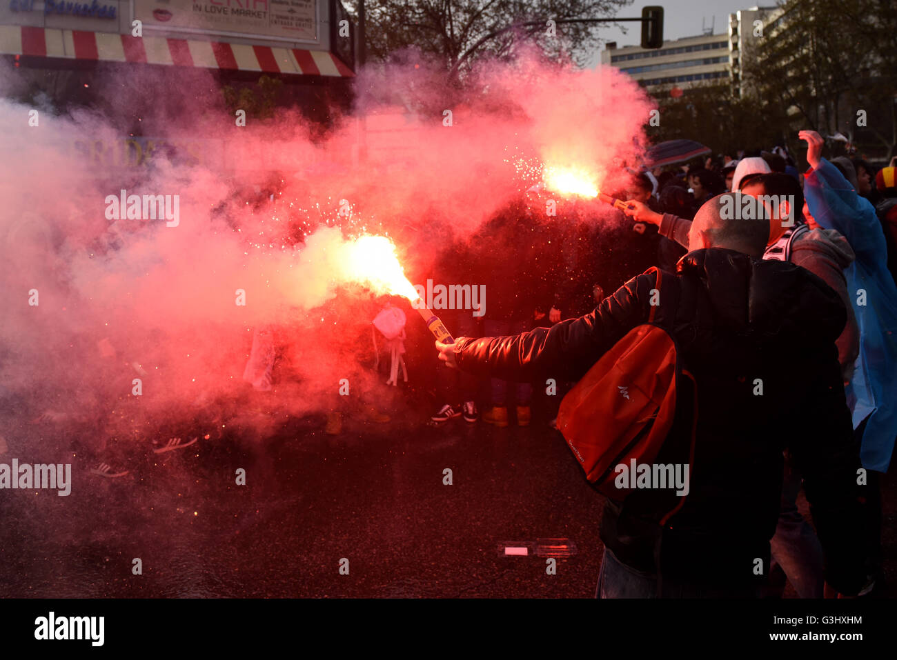 Real Madrid fans light flares as the players arrive at the Santiago ...