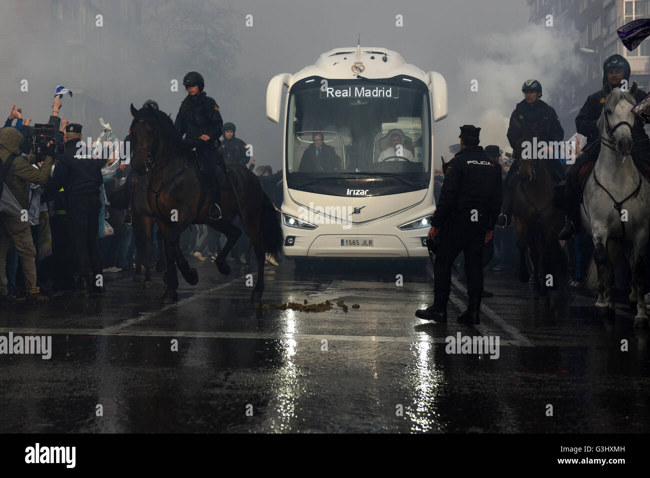 Real Madrid fans cheer as the players arrive at the Santiago Bernabeu ...