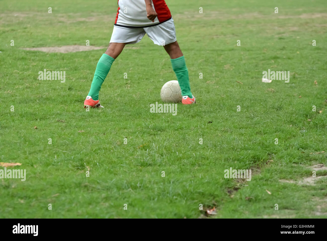 A soccer player is playing a soccer game Stock Photo - Alamy