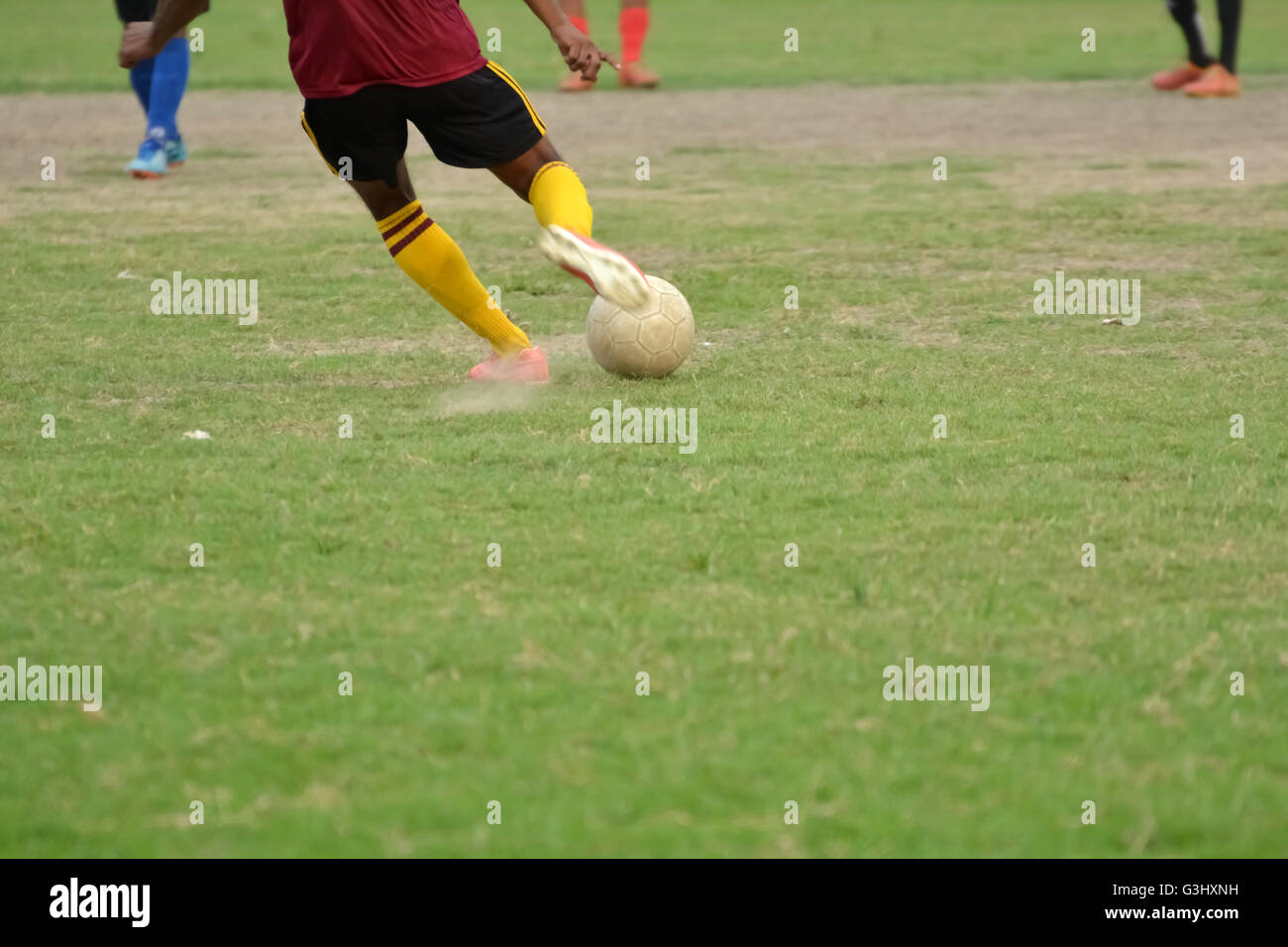 A soccer player is playing a soccer game Stock Photo - Alamy