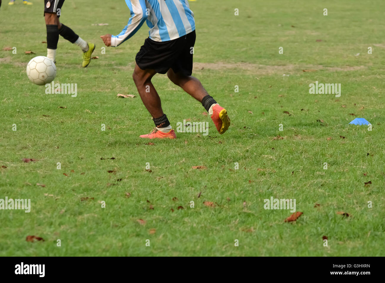 A soccer player is playing a soccer game Stock Photo - Alamy