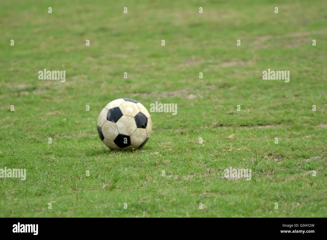 Soccer ball in a soccer pitch Stock Photo - Alamy