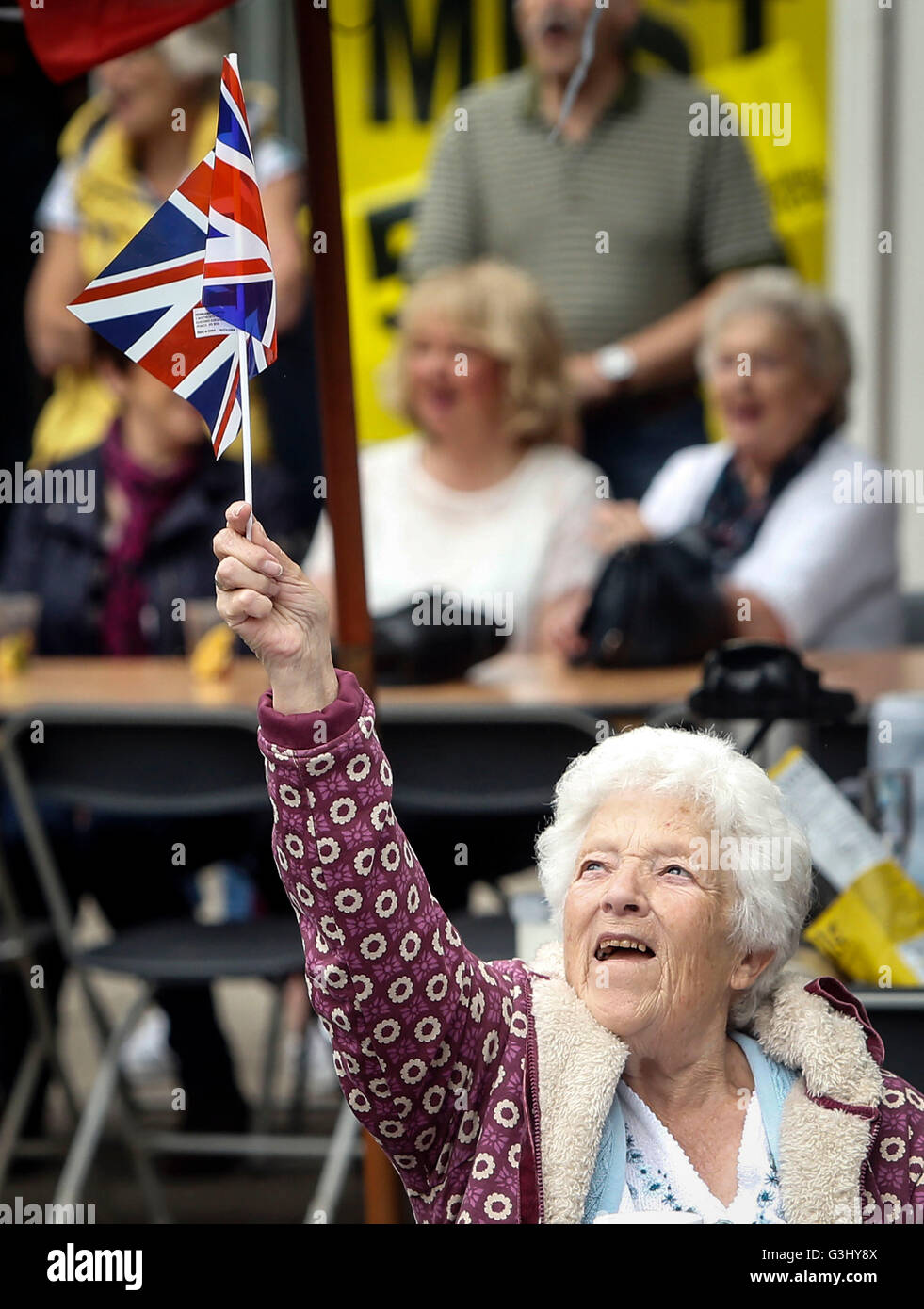 A woman celebrates as a toast to the Queen is made during the Grove's ...