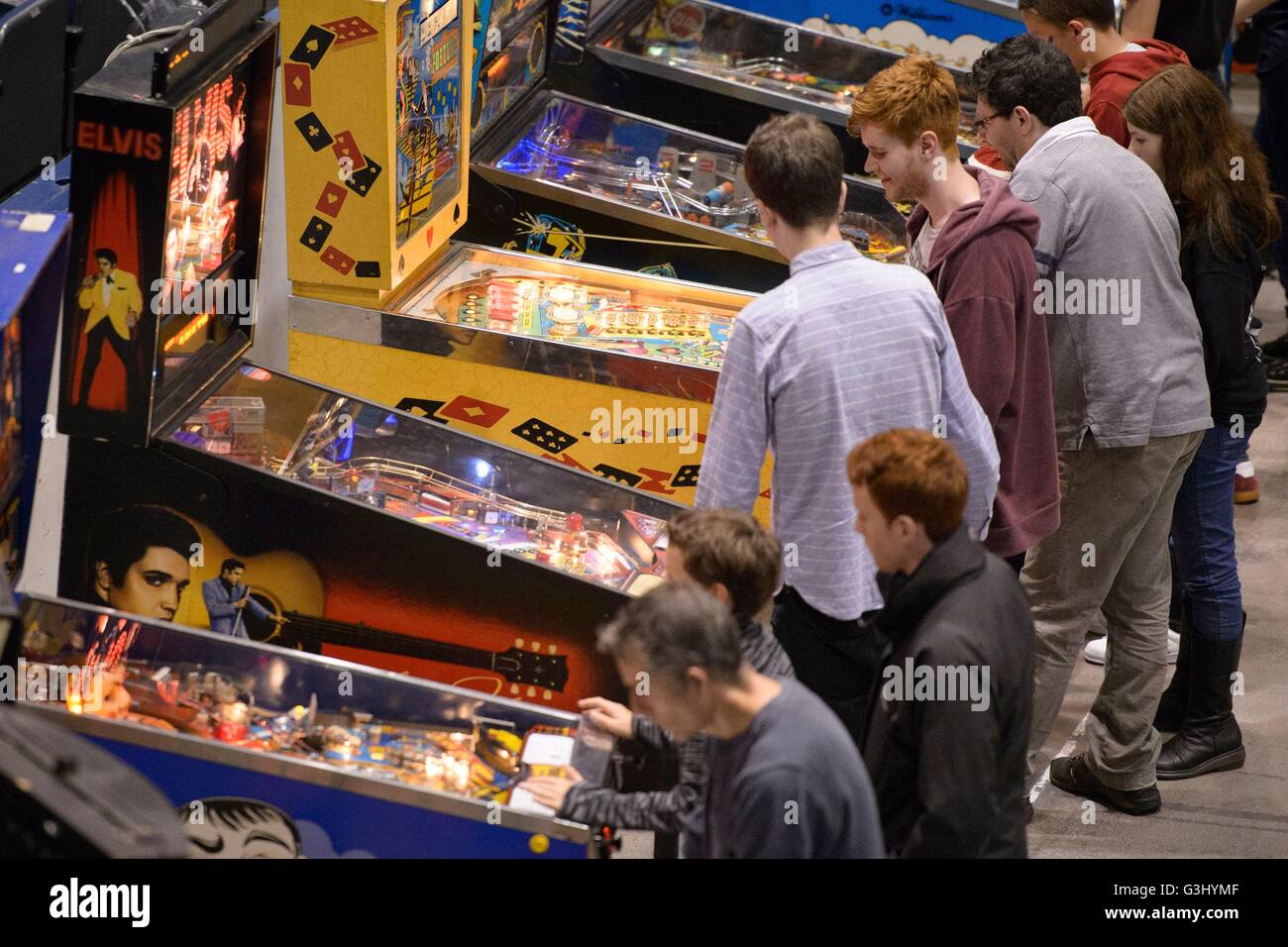 People play on pinball machines, as fans of computer gaming attend the ...