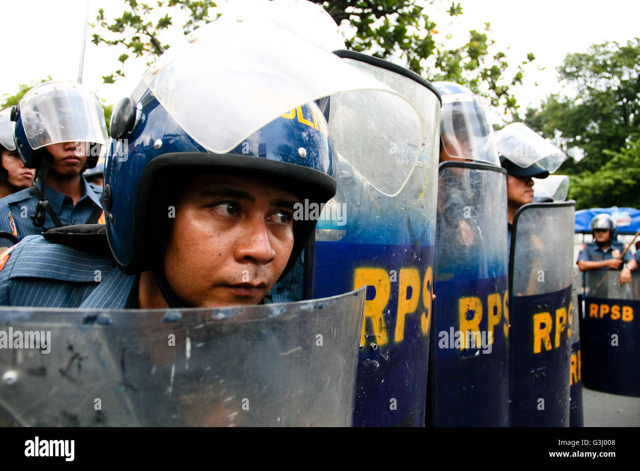 Manila, Philippines. 12th June, 2016. A police officer prepares his ...