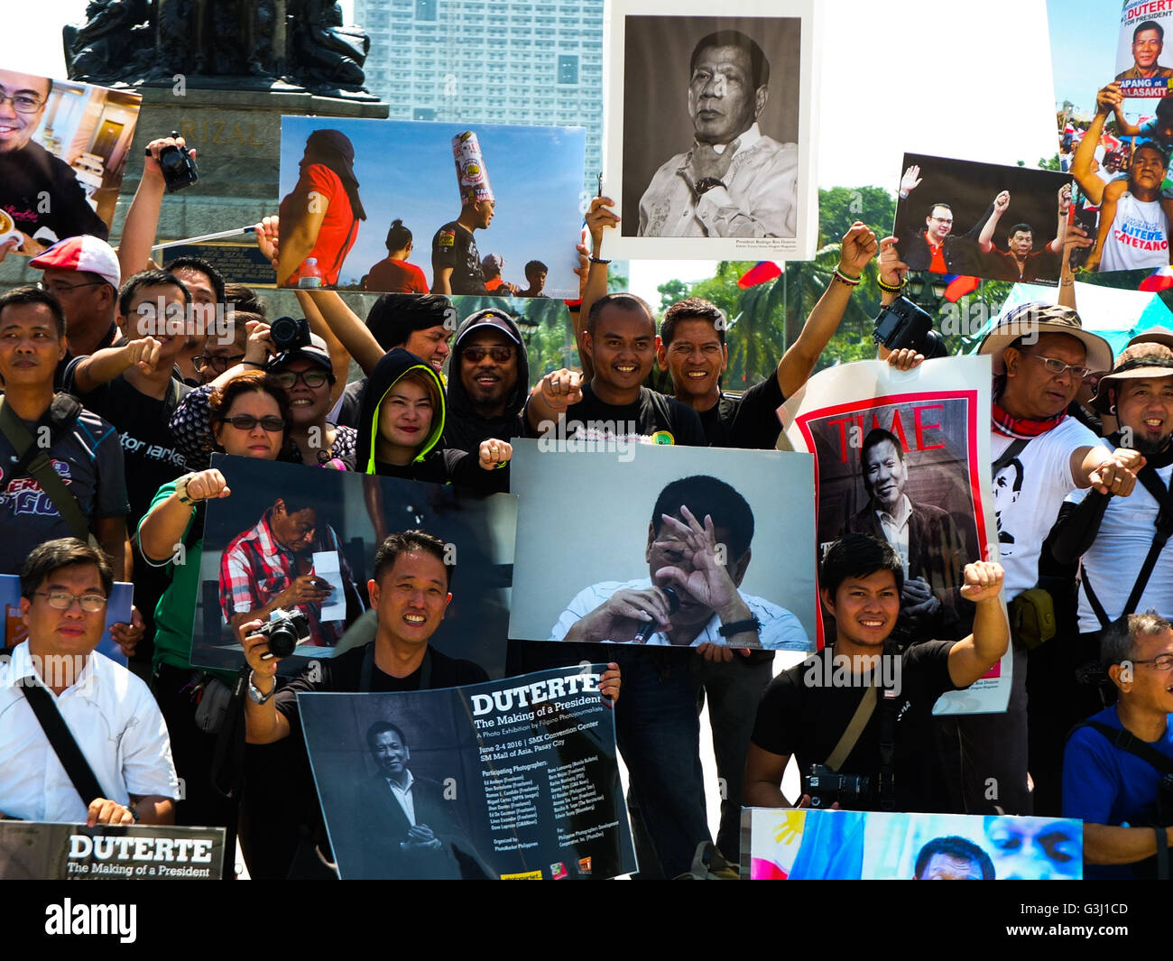 Filipino Photographers, holding their portraits, images of President ...