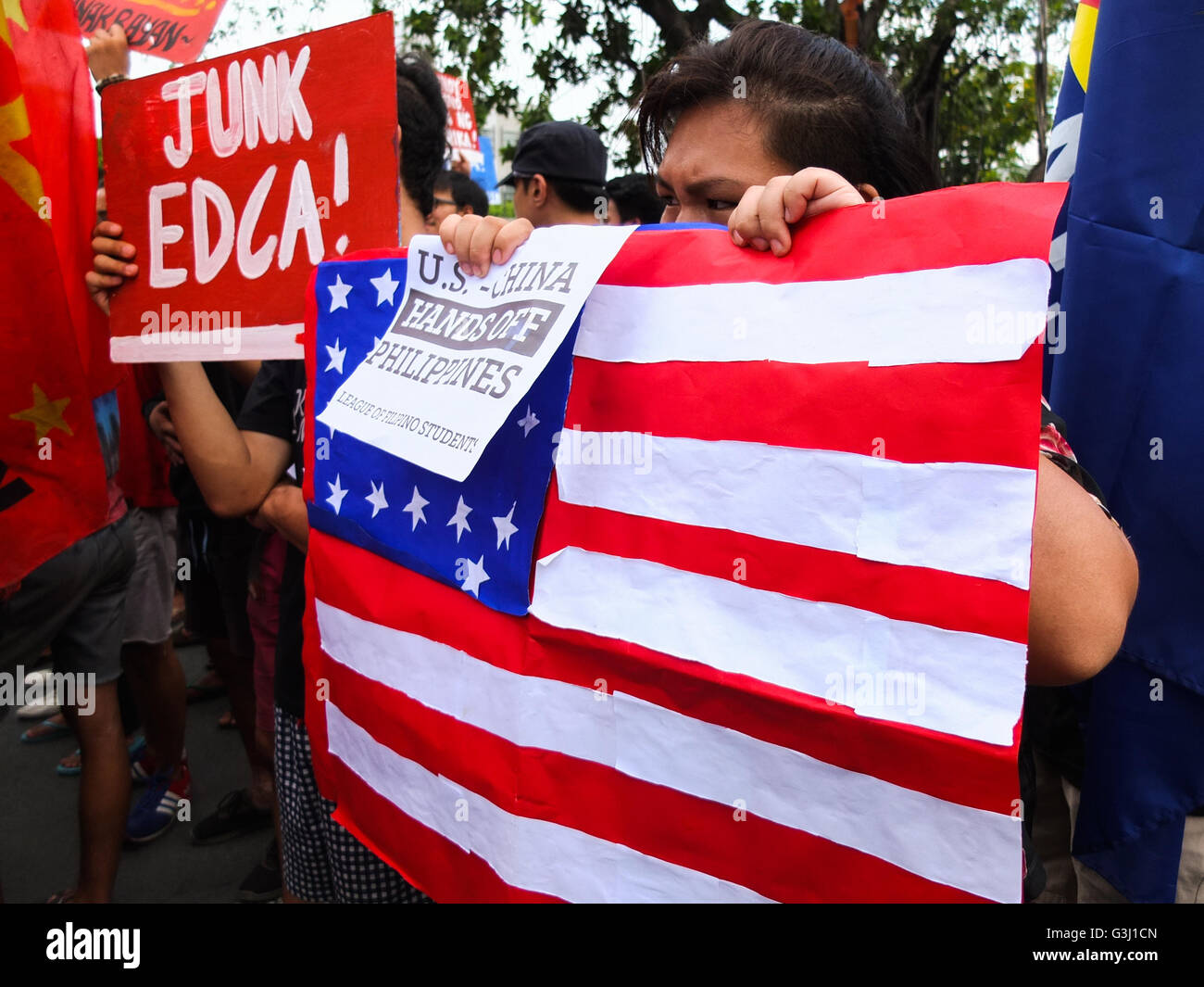 Manila, Philippines. 12th June, 2016. A woman holding a replica of an ...