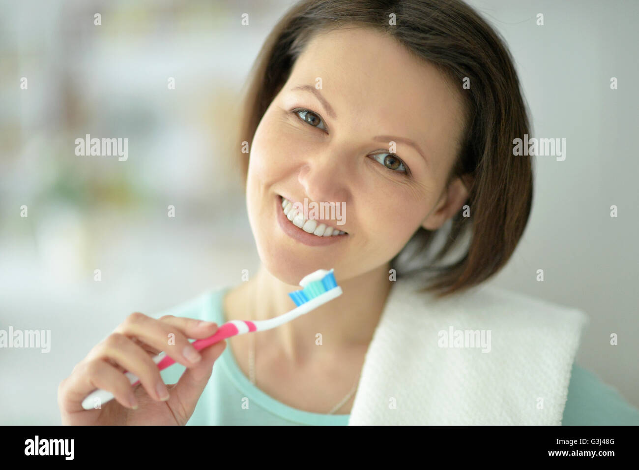 Woman brushing her teeth Stock Photo - Alamy