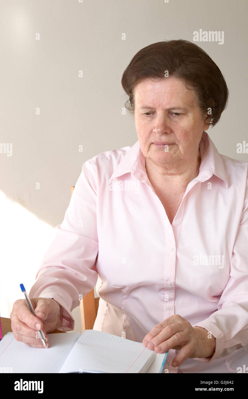 Mature woman pen hi-res stock photography and images - Alamy