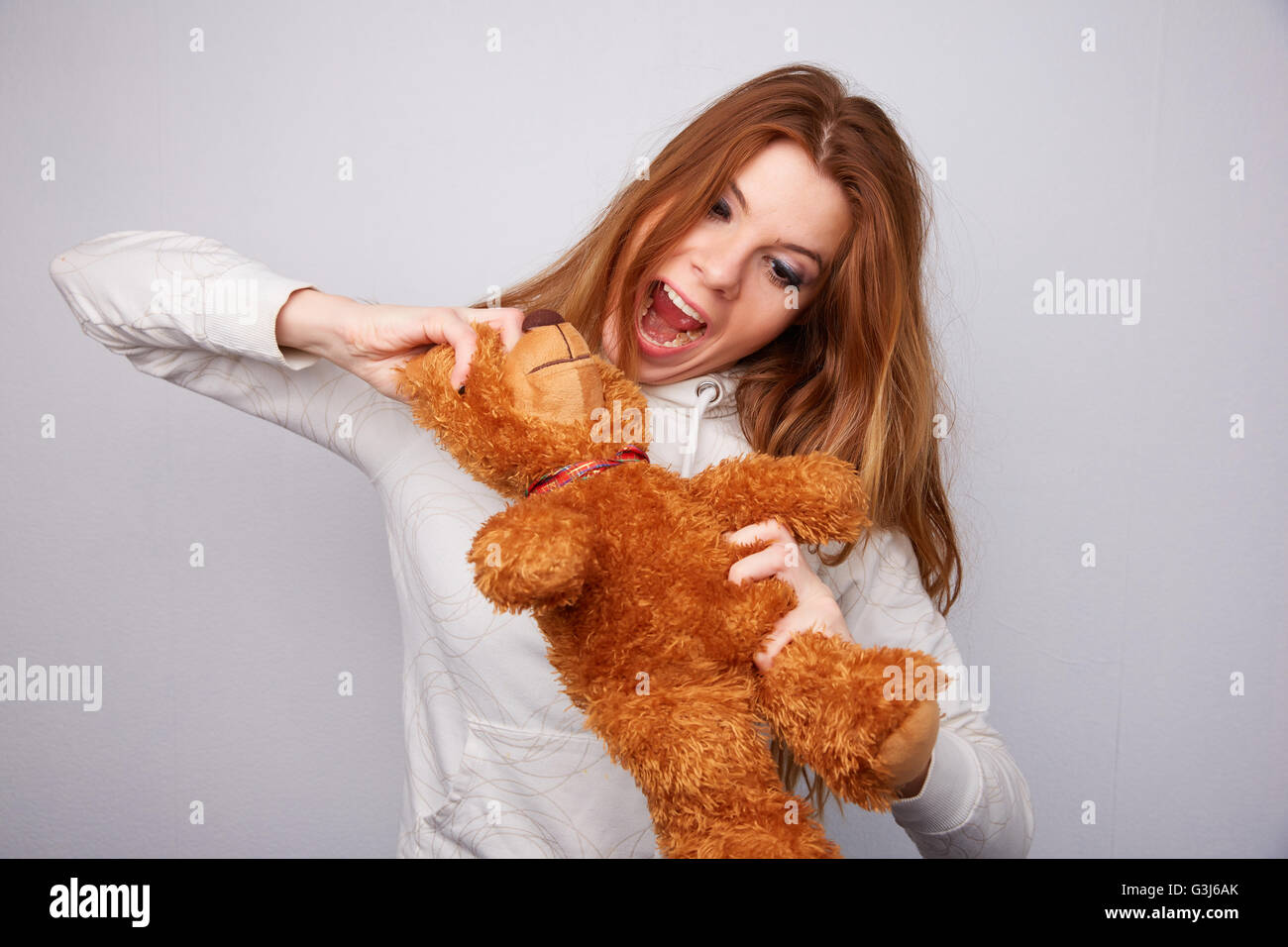 girl breaks teddy bear Stock Photo - Alamy