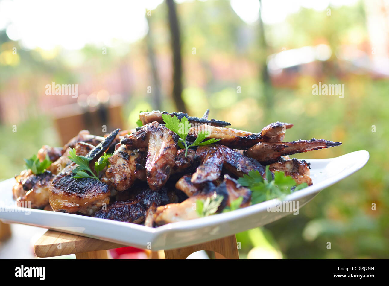 grilled chicken wings outdoor Stock Photo - Alamy