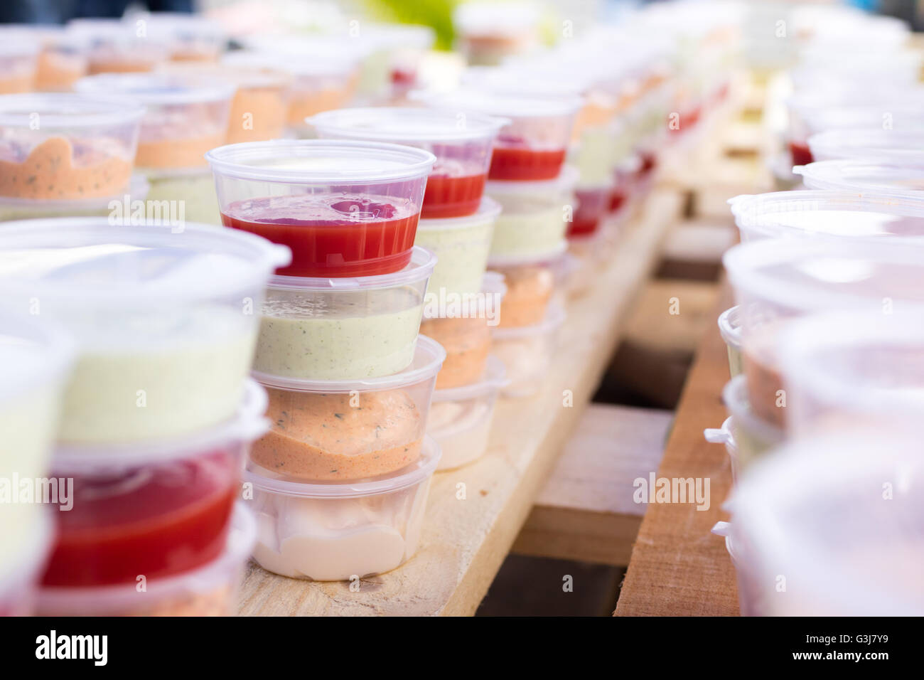 sauces in plastic containers for buffet Stock Photo - Alamy