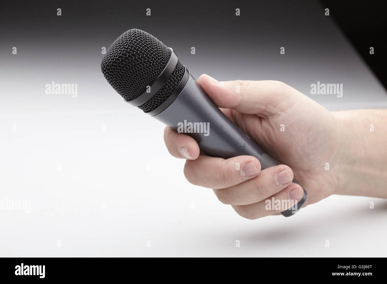 Arm holding microphone hi-res stock photography and images - Alamy