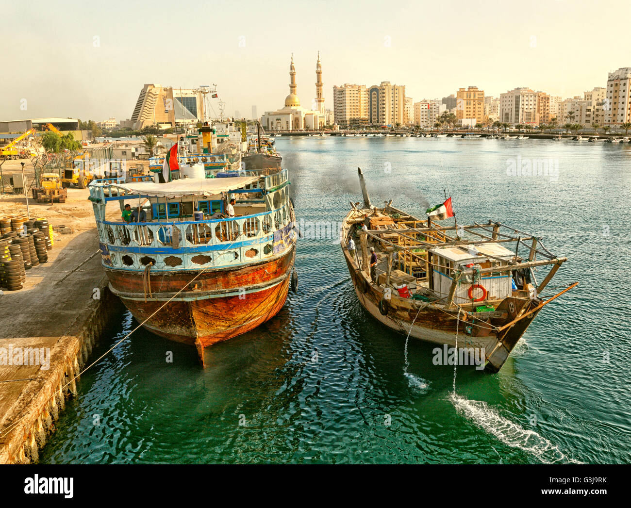 Vintage photo of Dhow boats in the port of Sharjah, Dubai Stock Photo ...