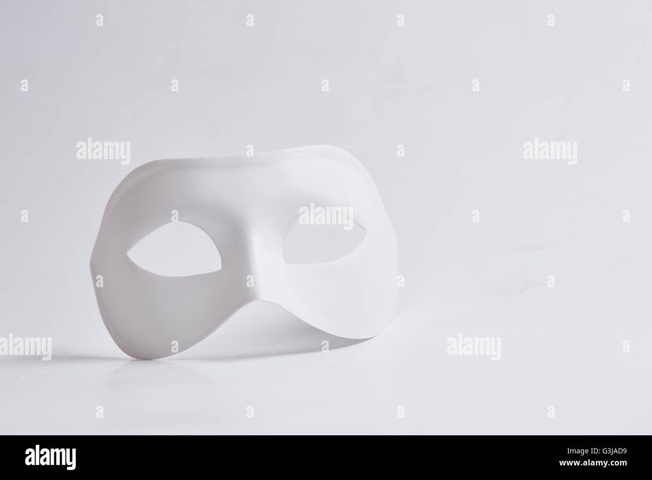 white venetian mask on a white background Stock Photo - Alamy