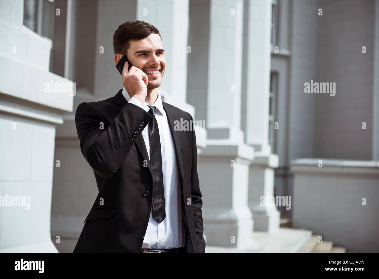 Pleasant delighted man talking hi-res stock photography and images - Alamy