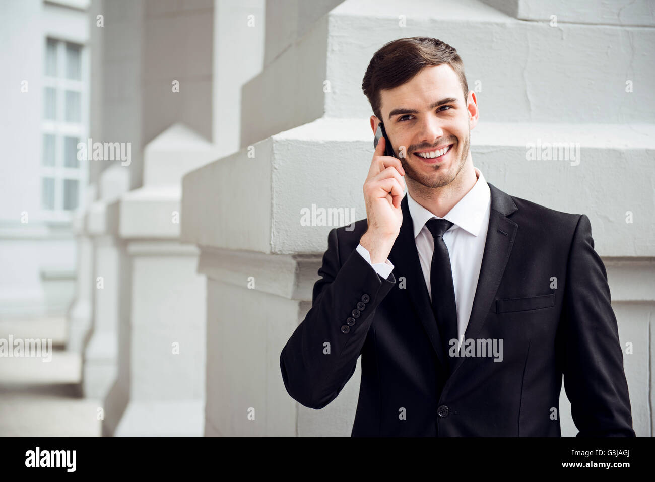 Pleasant delighted man talking hi-res stock photography and images - Alamy