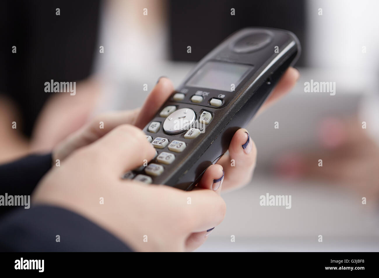 Radio phone in female hands Stock Photo - Alamy