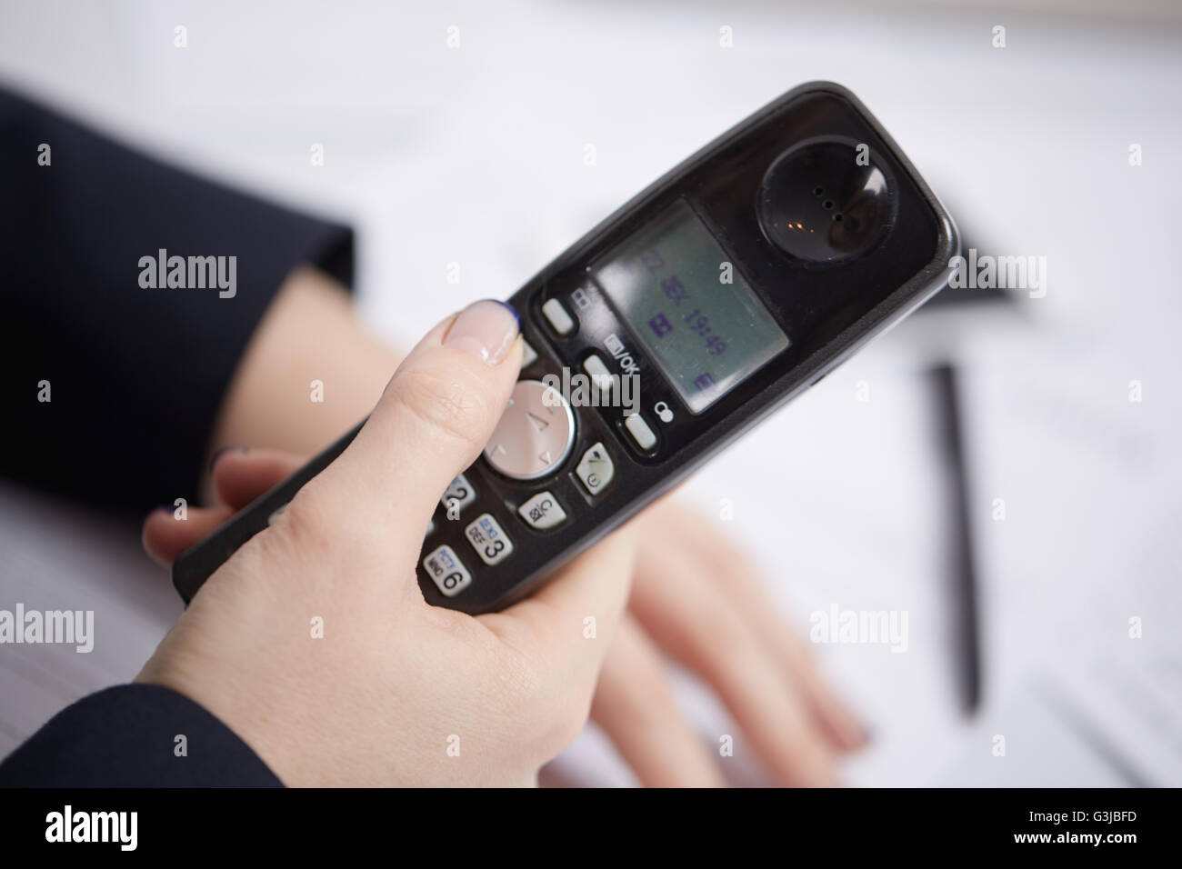 Radio phone in female hands Stock Photo - Alamy