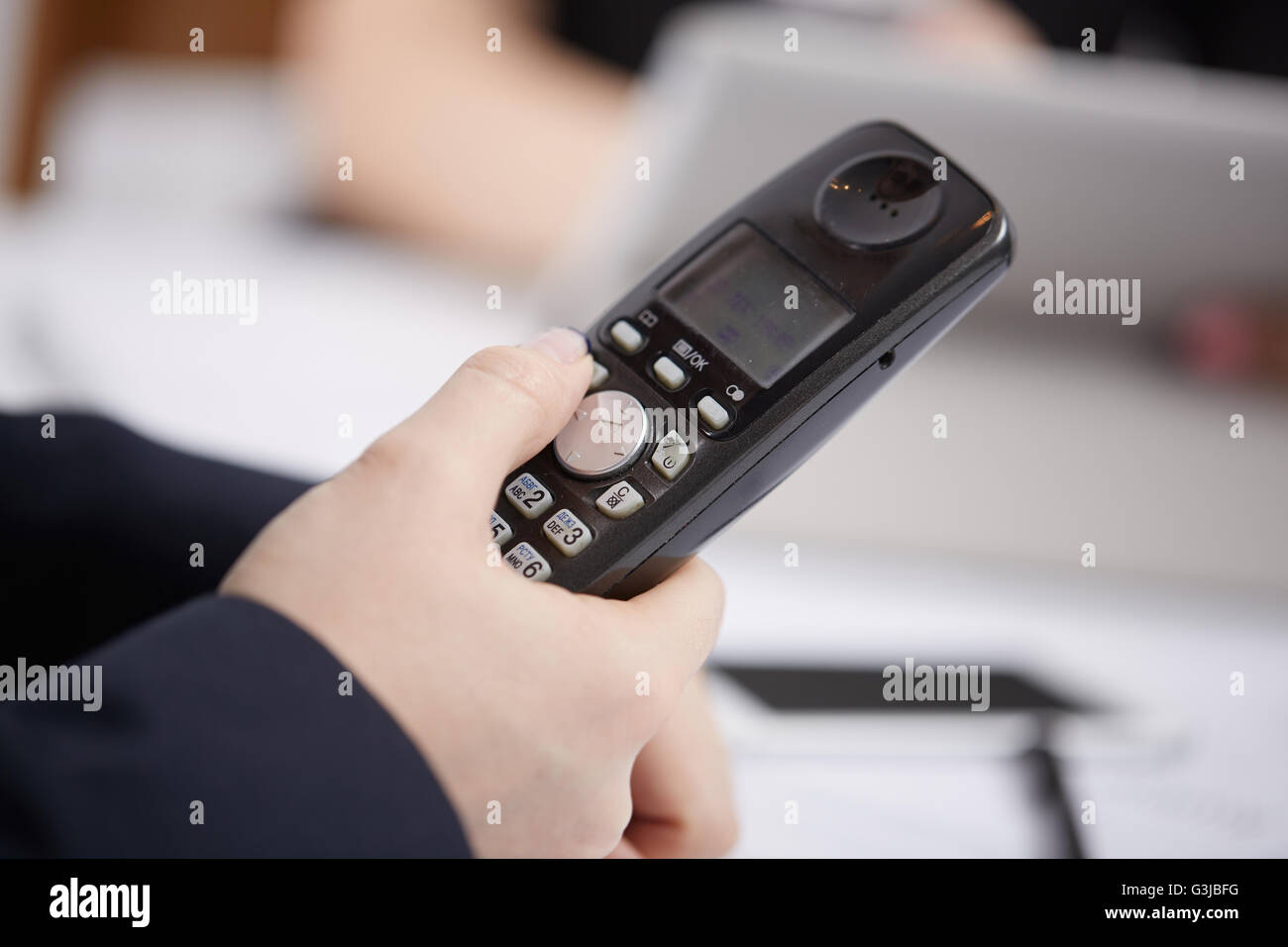 Radio phone in female hands Stock Photo - Alamy