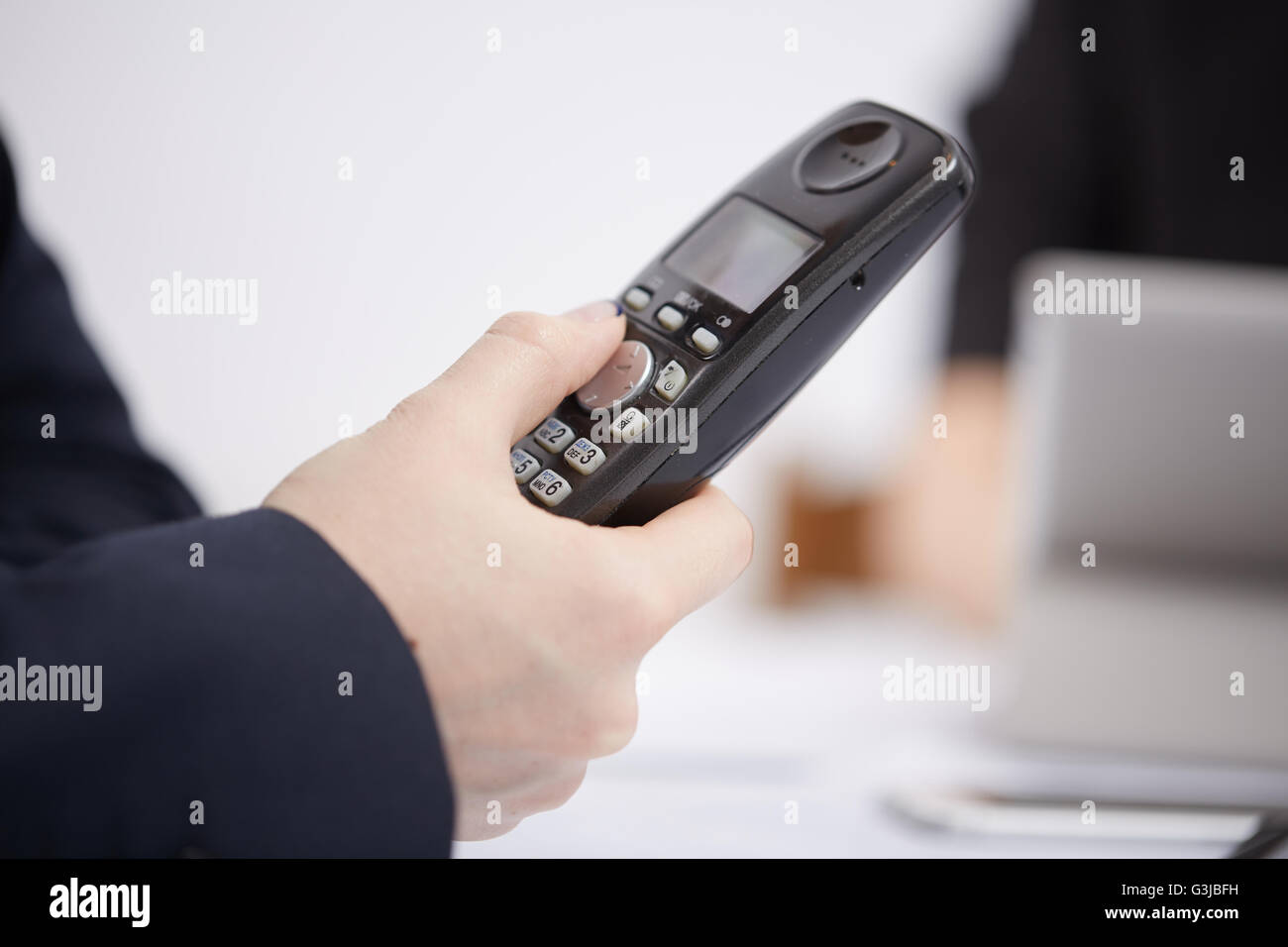 Radio phone in female hands Stock Photo - Alamy