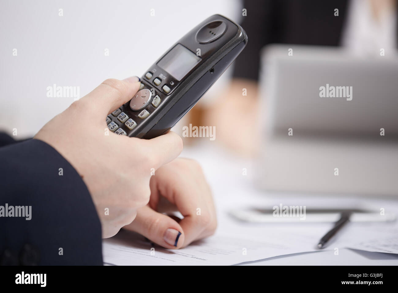 Radio phone in female hands Stock Photo - Alamy