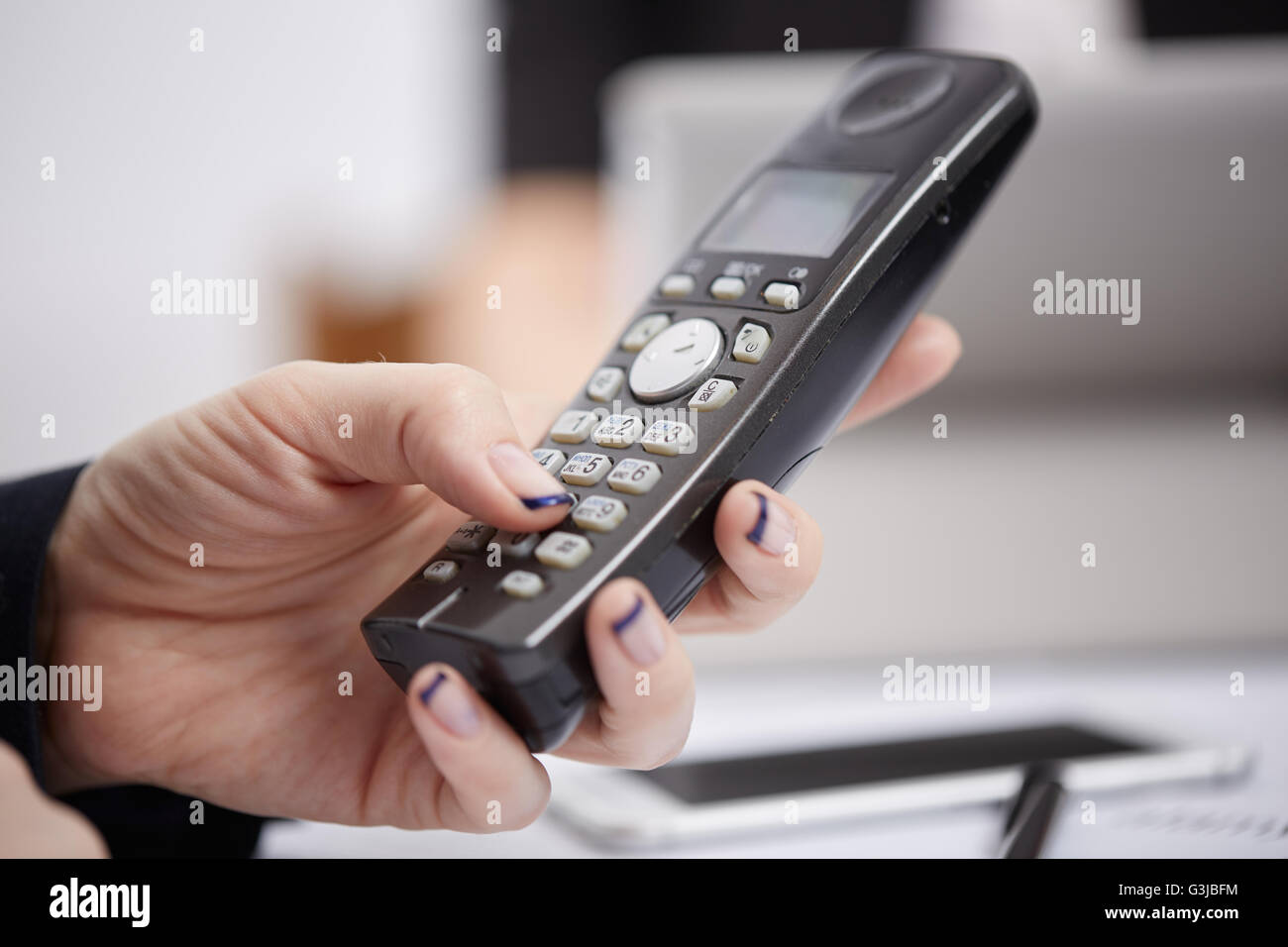 Radio phone in female hands Stock Photo - Alamy