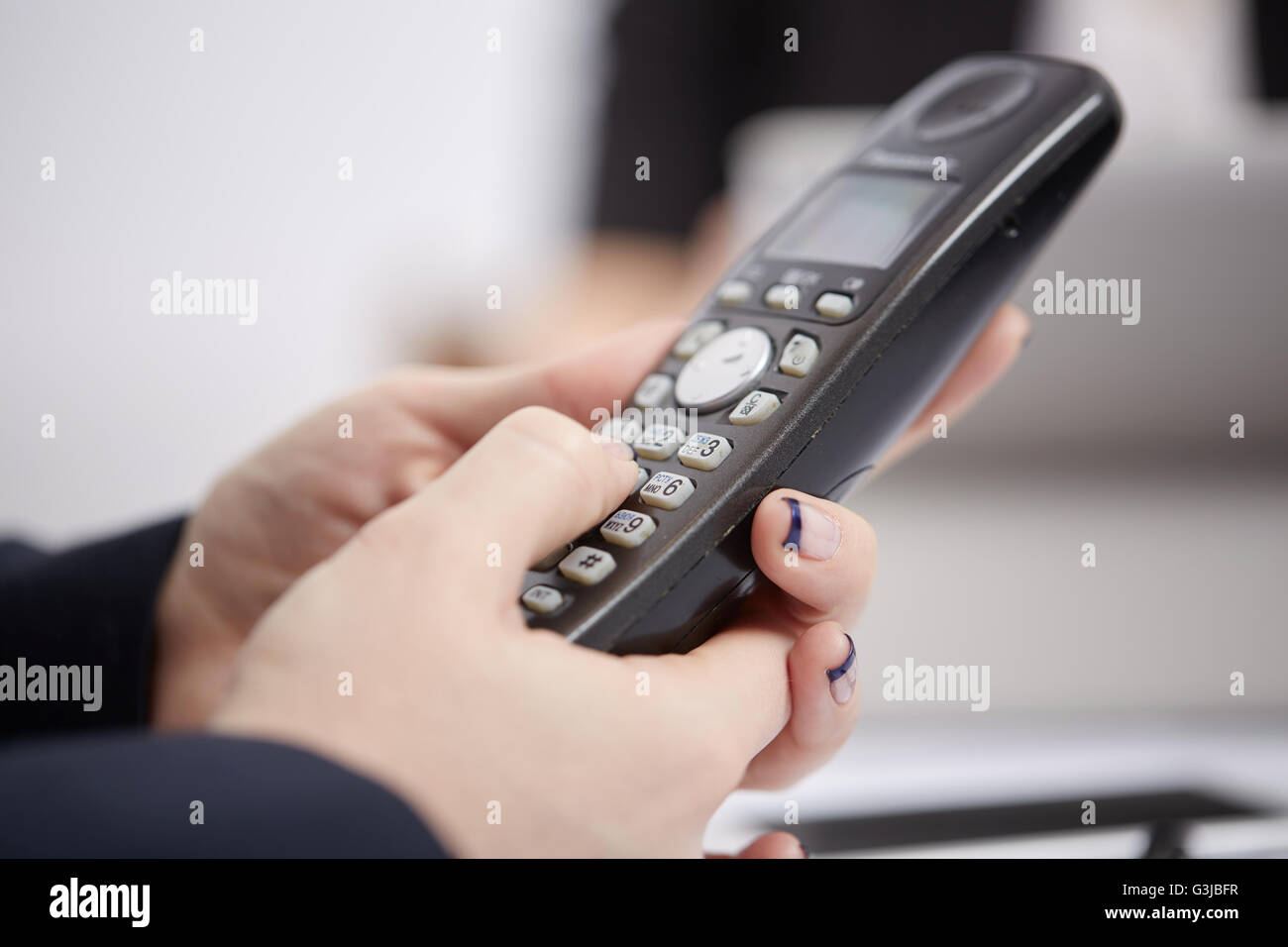 Radio phone in female hands Stock Photo - Alamy