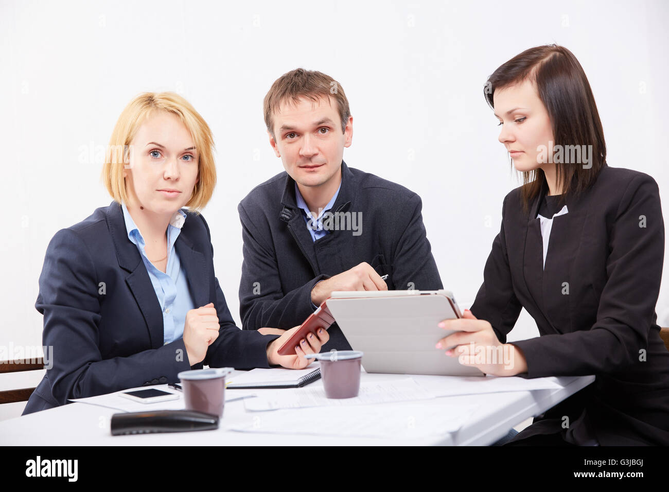 Three businessmen at a meeting Stock Photo - Alamy