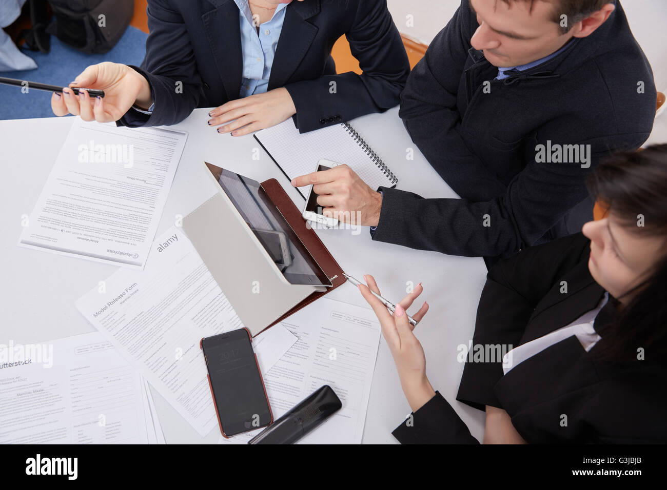 Three businessmen at a meeting Stock Photo - Alamy