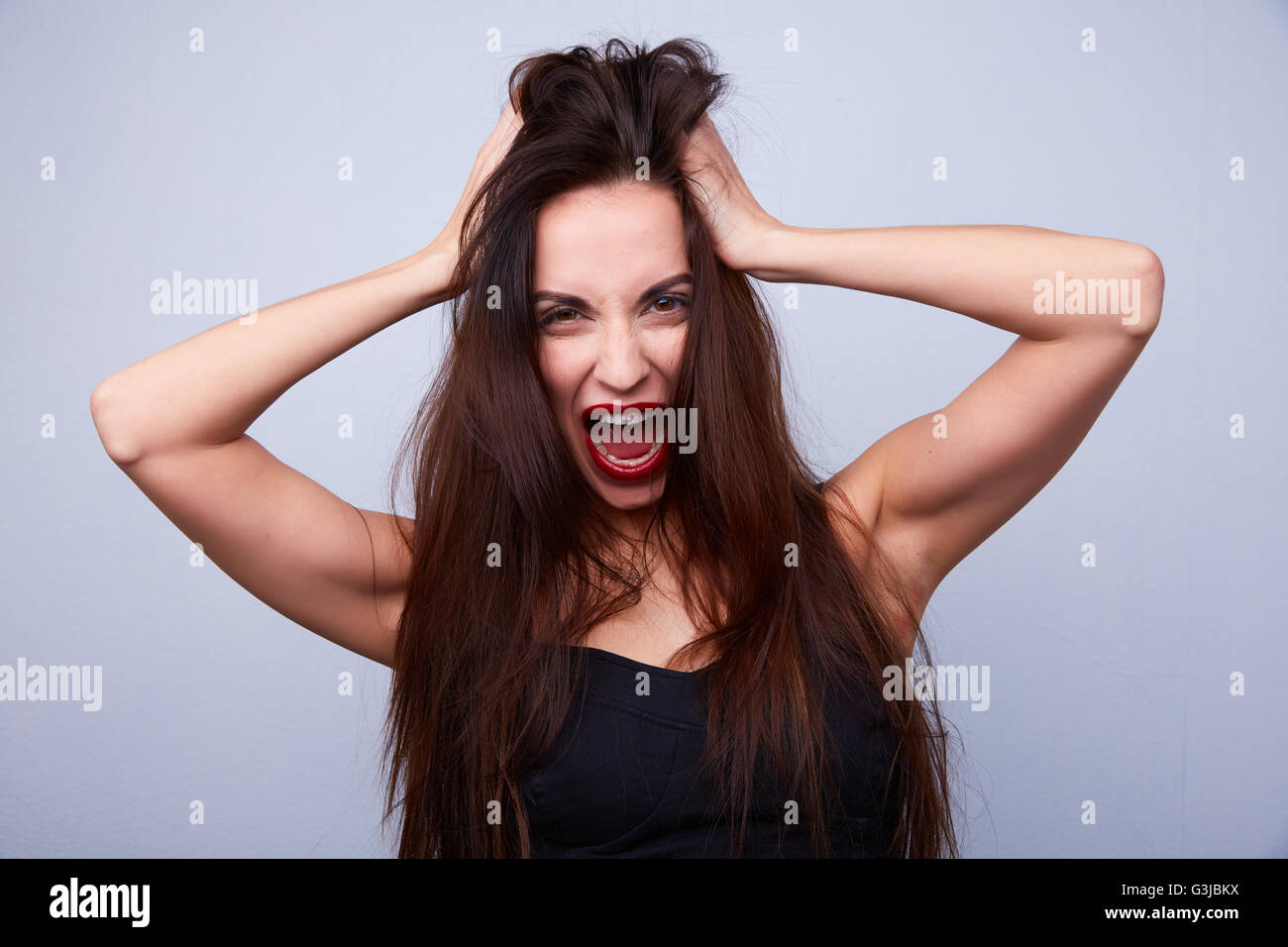 woman screaming and holding his head Stock Photo - Alamy