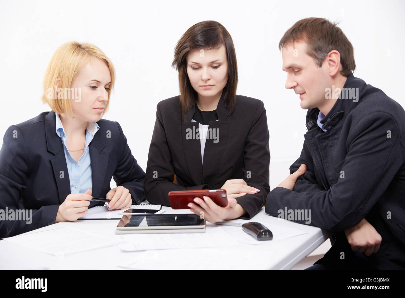 Three businessmen at a meeting Stock Photo - Alamy