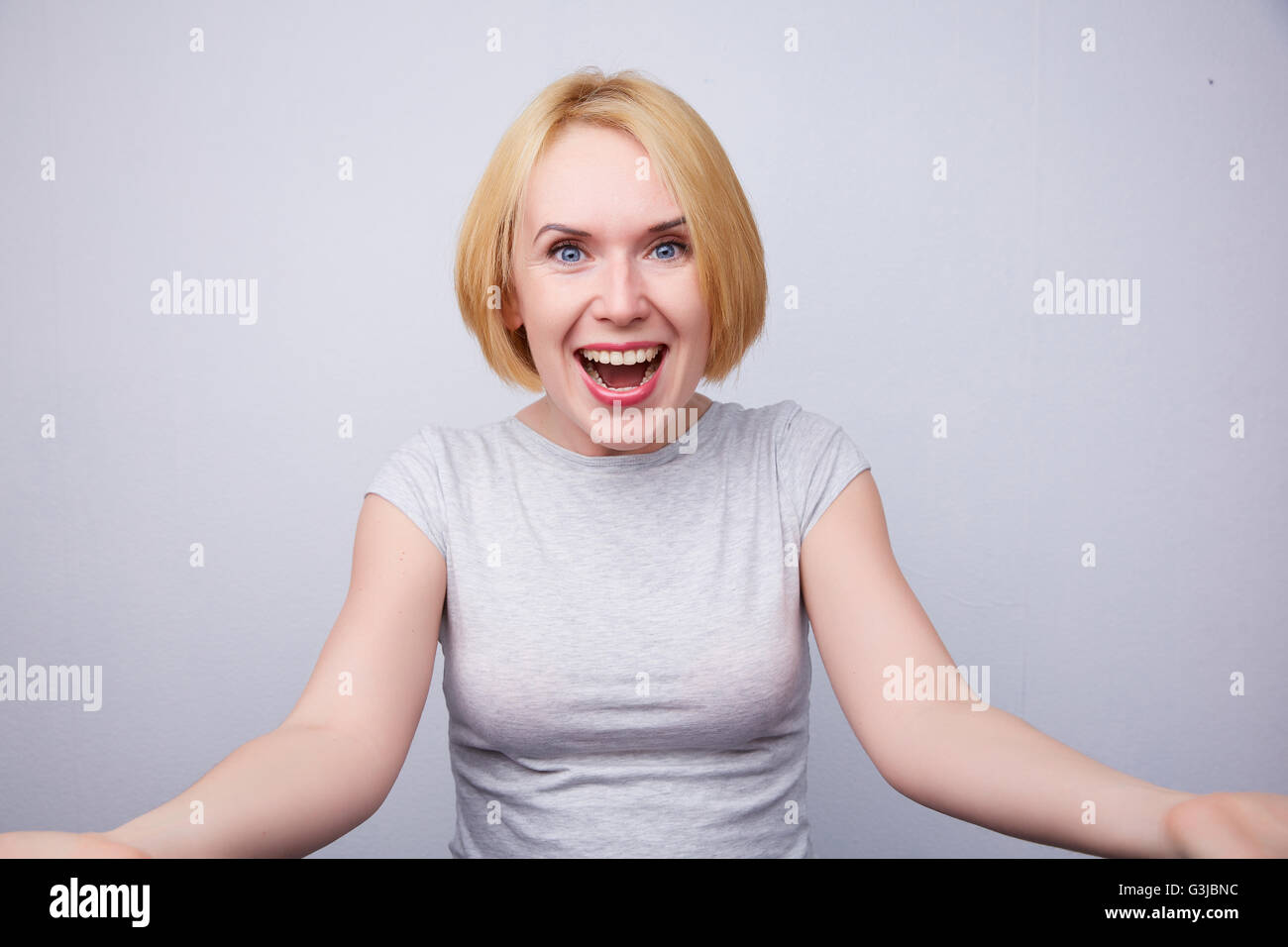blonde surprised and pleased Stock Photo - Alamy