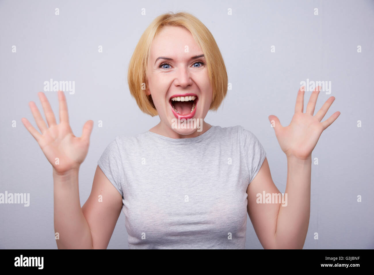 blonde surprised and pleased Stock Photo - Alamy