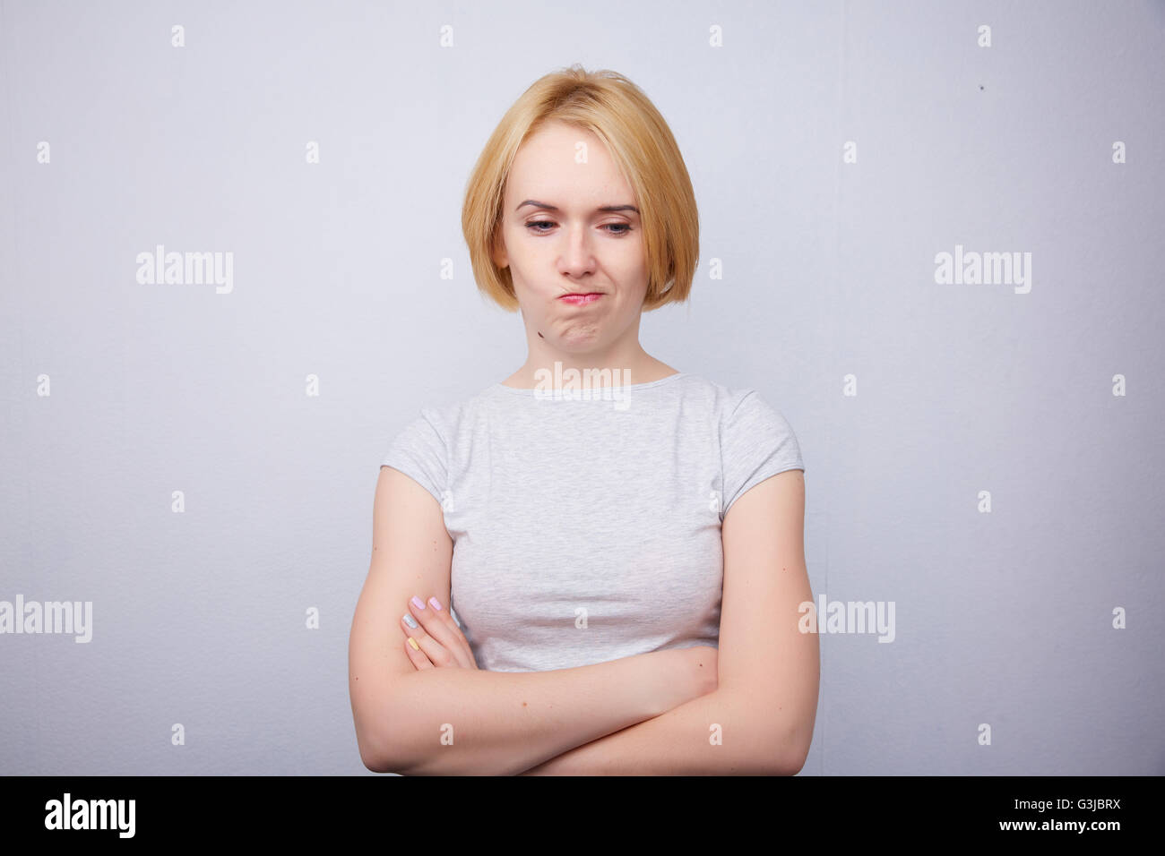 blonde guilty look Stock Photo - Alamy