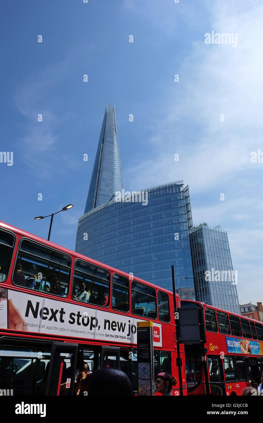 London buses and the Shard in the background Stock Photo - Alamy