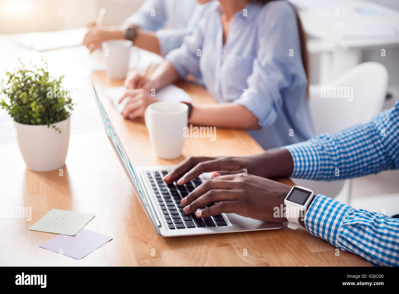 Involved colleagues working together Stock Photo - Alamy