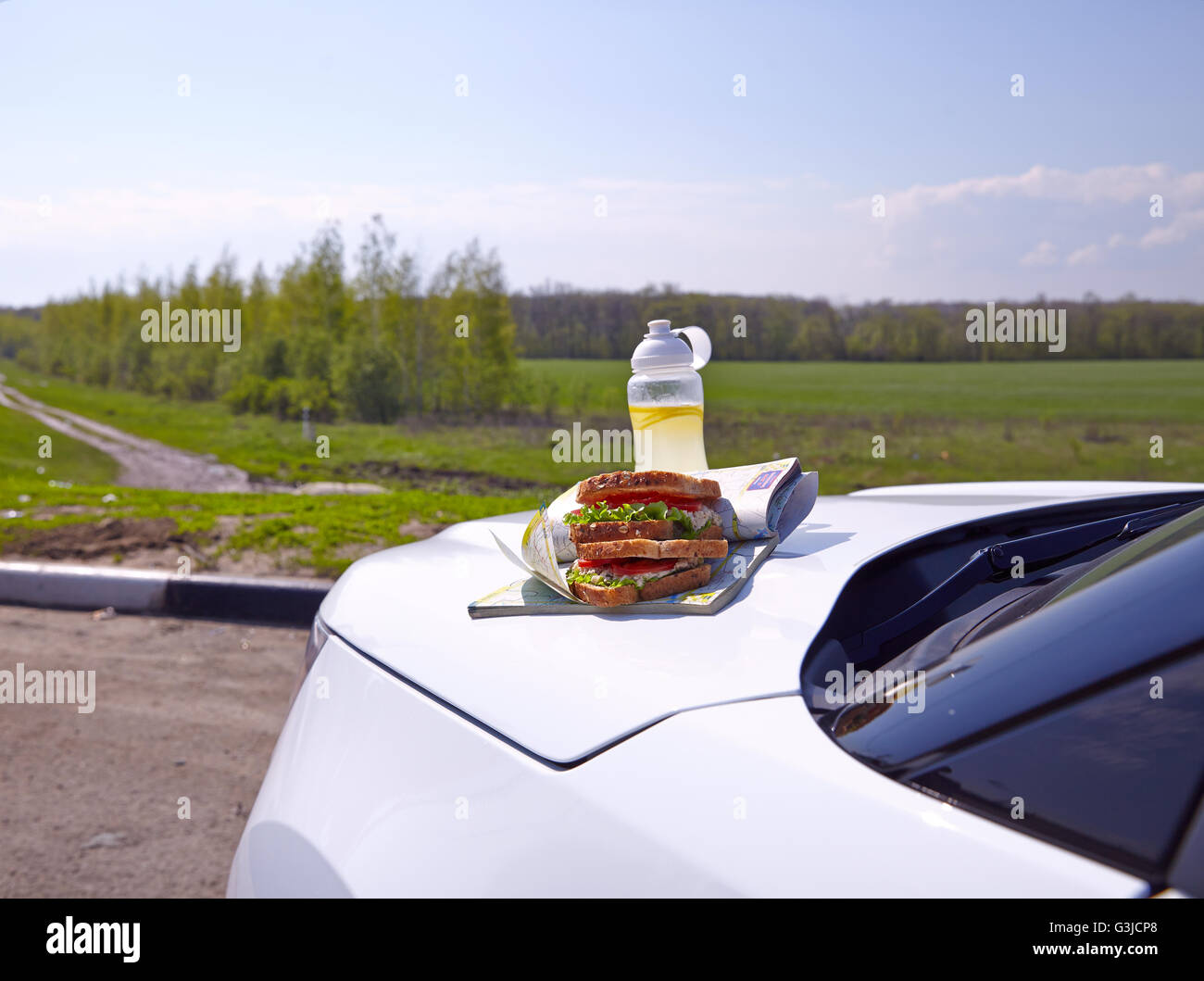 Road trip breakfast on a car hood - sandwiches and lemonade Stock Photo ...