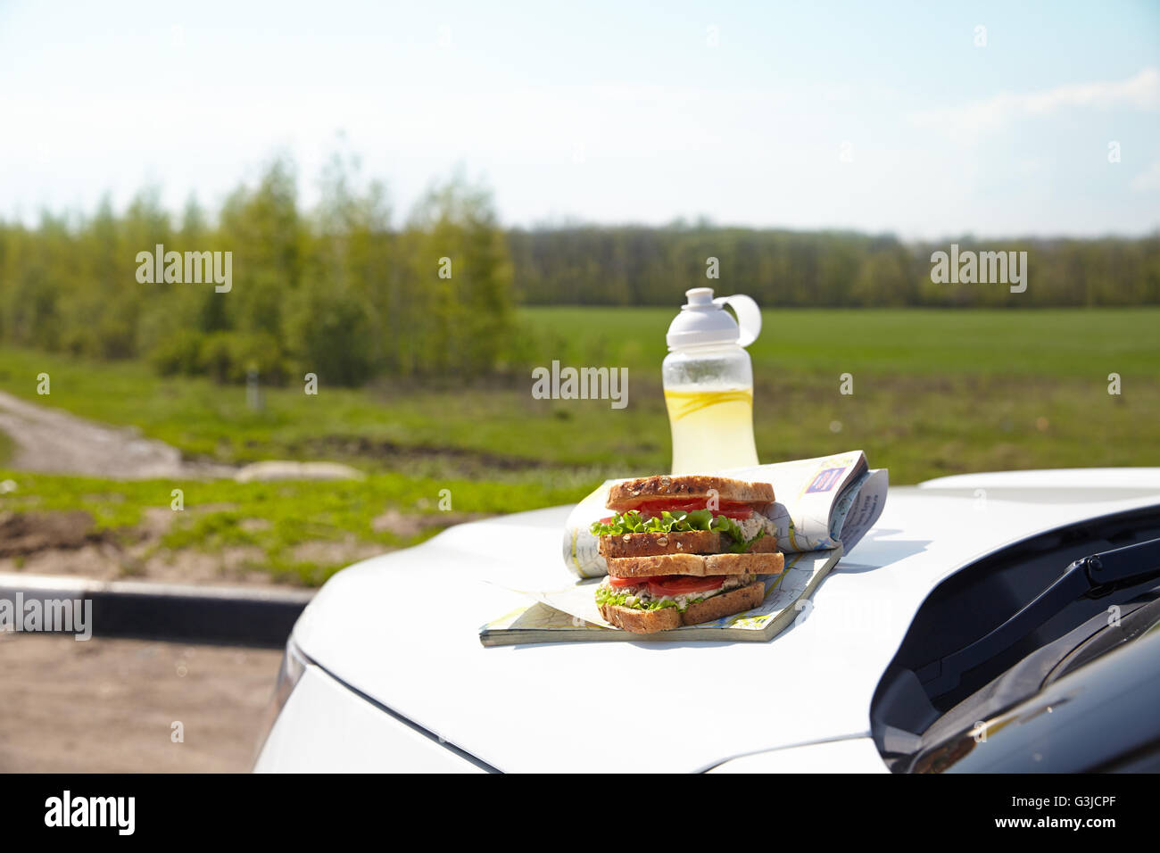 Road trip breakfast on a car hood - sandwiches and lemonade Stock Photo ...
