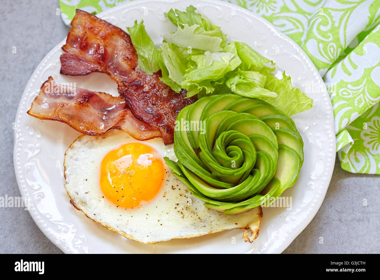 Fried Egg, Bacon and Avocado Rose. Low carb high fat breakfast Stock ...