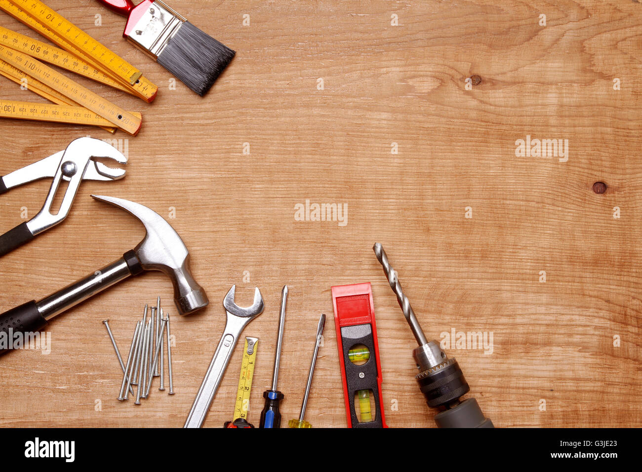 Assorted work tools on wood Stock Photo - Alamy