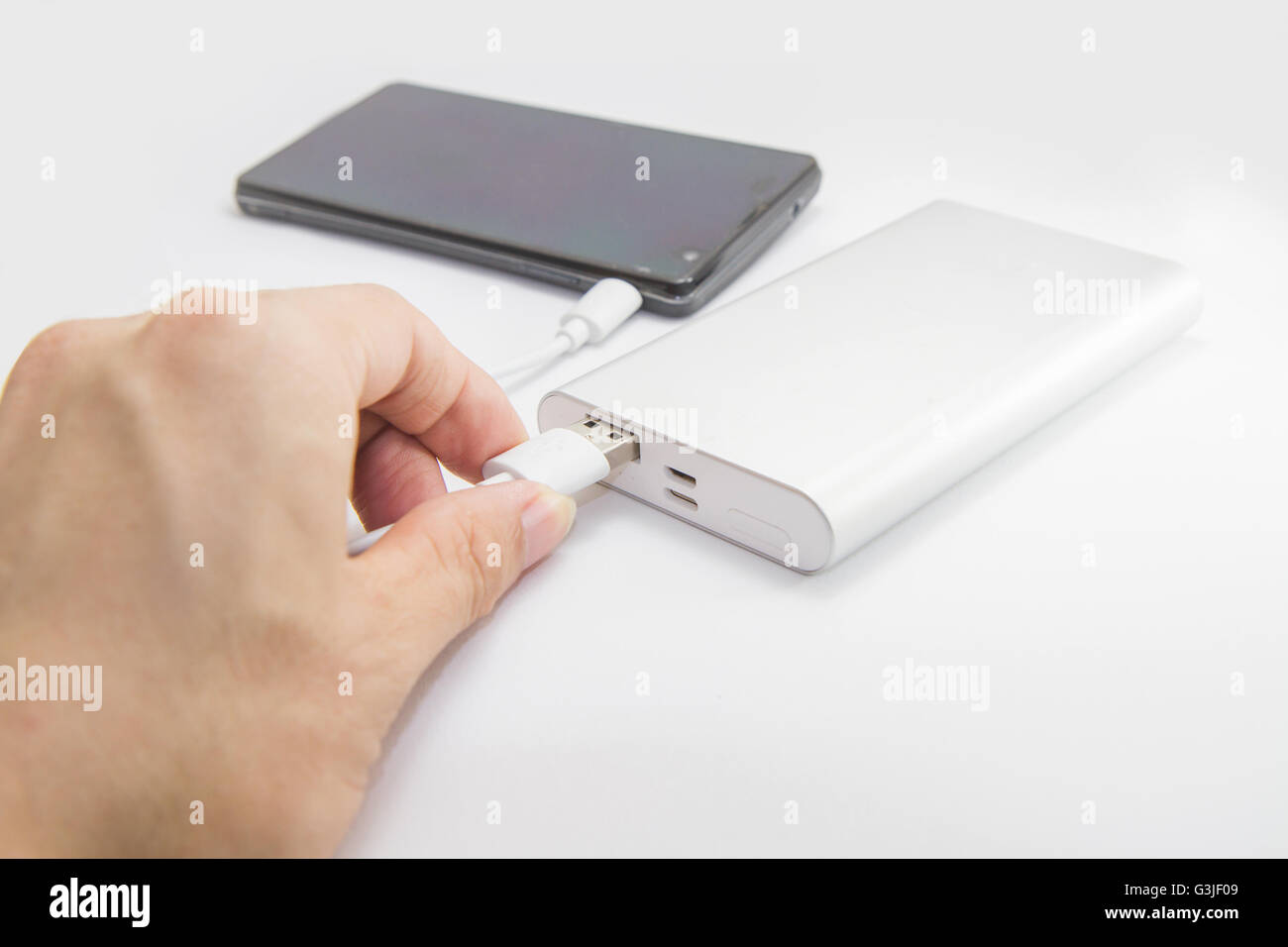 connect the power bank to mobile phone Stock Photo - Alamy
