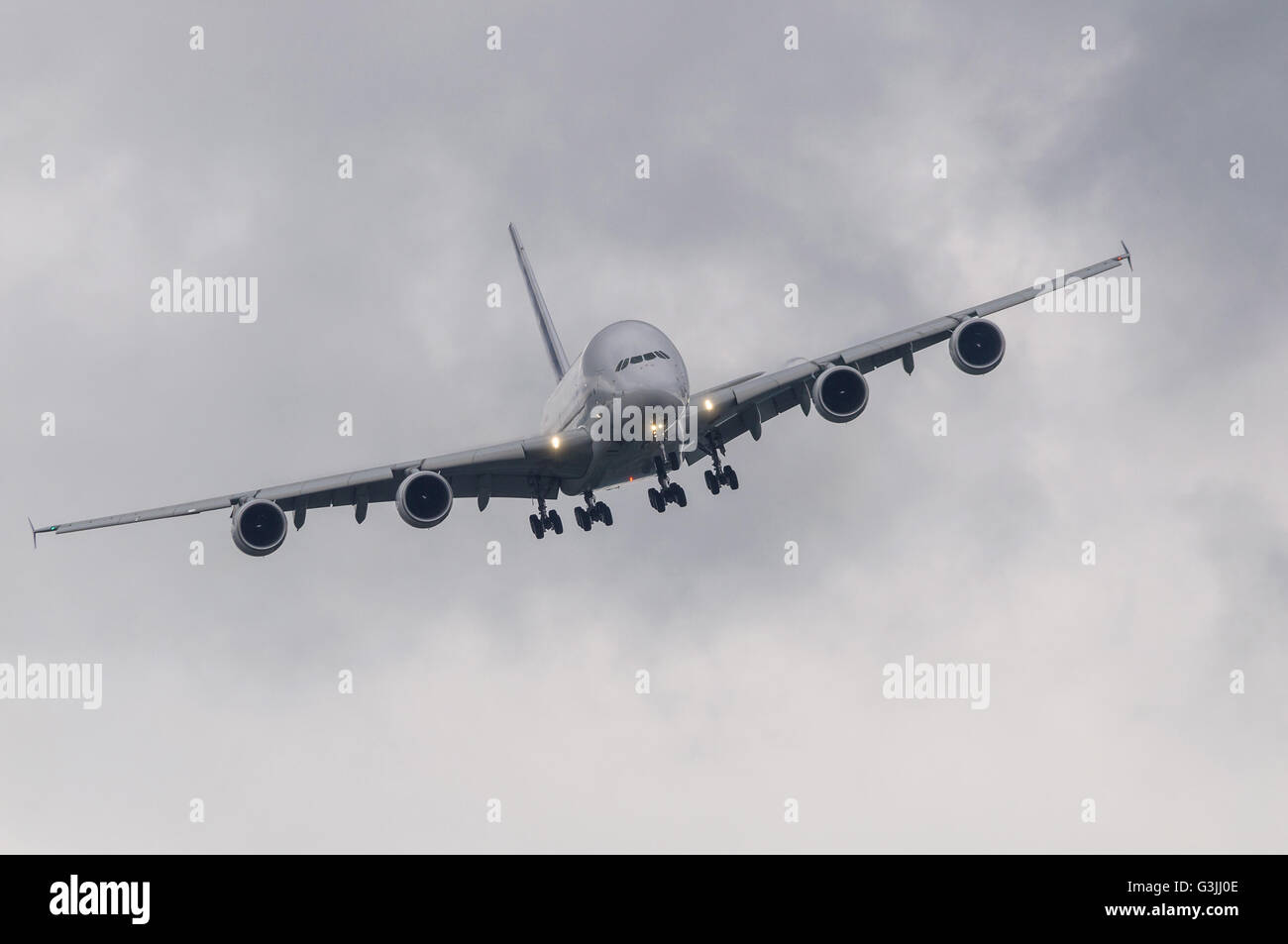 Passenger airliner approaching for landing in bad weather Stock Photo ...