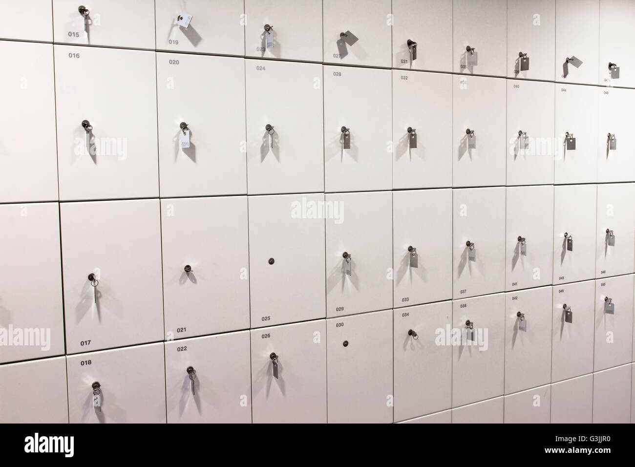 White lockers with keys Stock Photo - Alamy