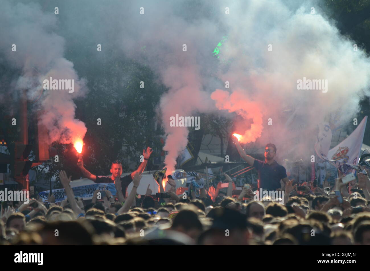Real Madrid fans cheer as the players arrive at the Santiago Bernabeu ...