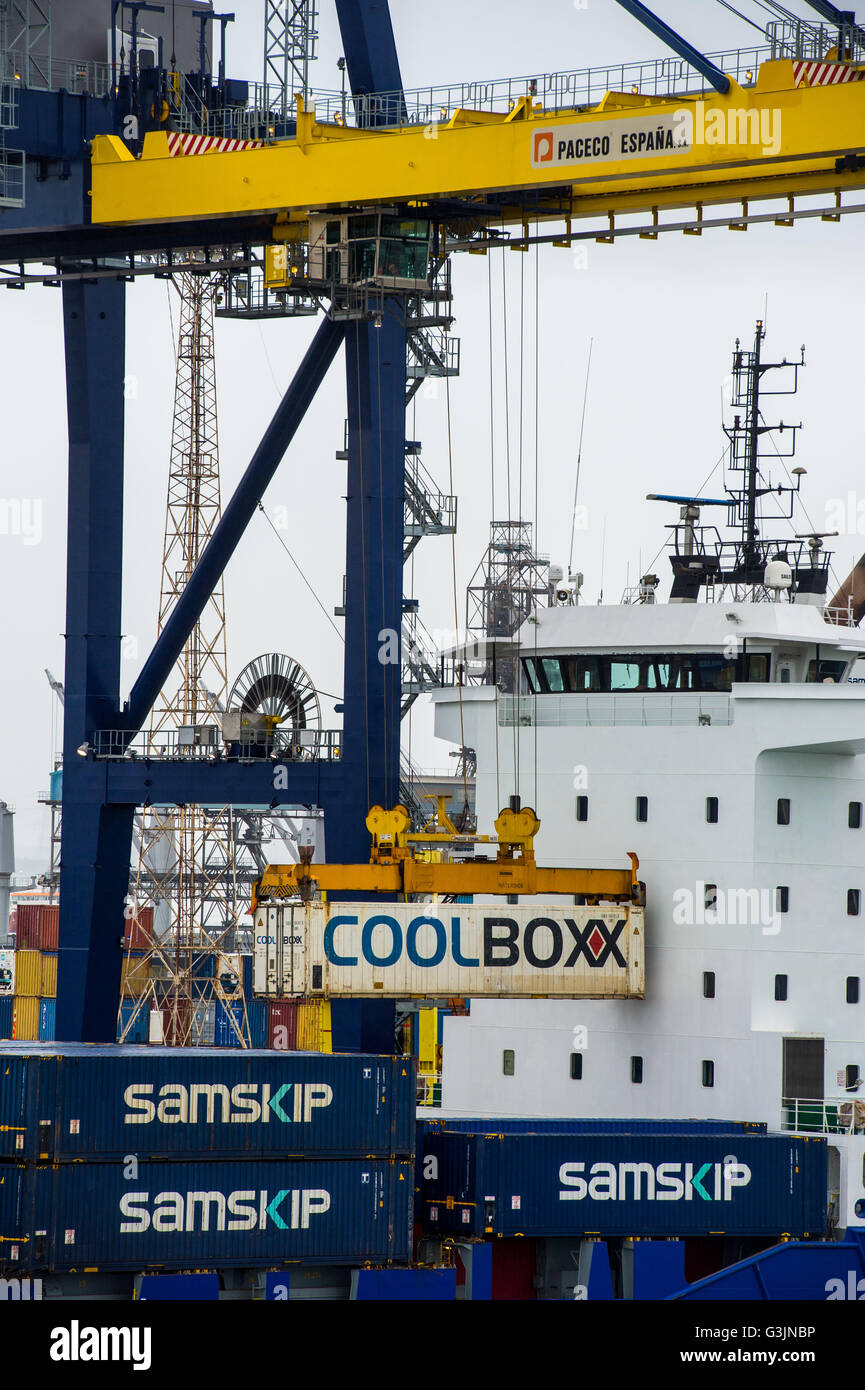 Shipping containers and ship at Tilbury Docks in London Stock Photo - Alamy