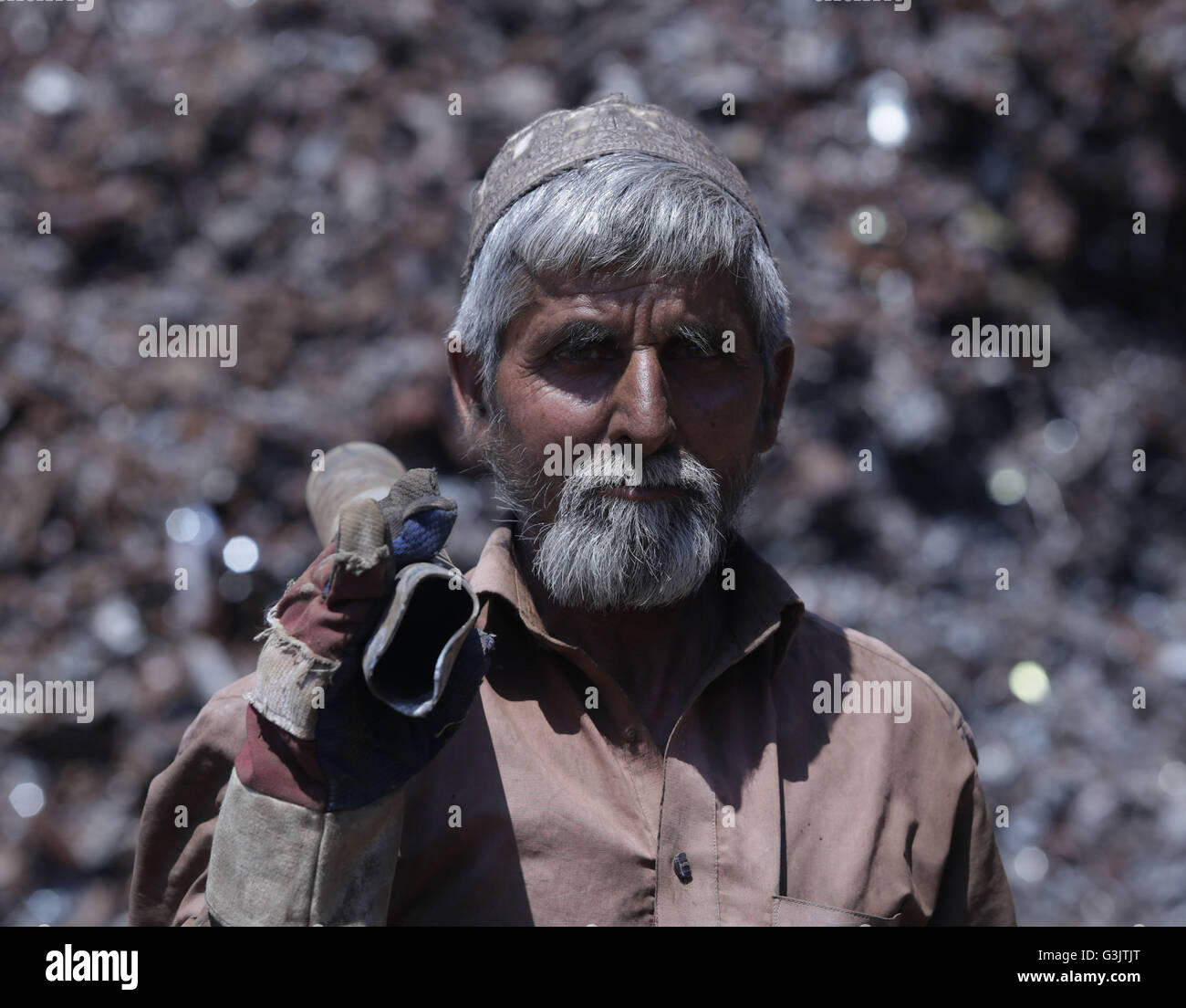 Pakistani blacksmiths work at an iron molding factory in an industrial ...