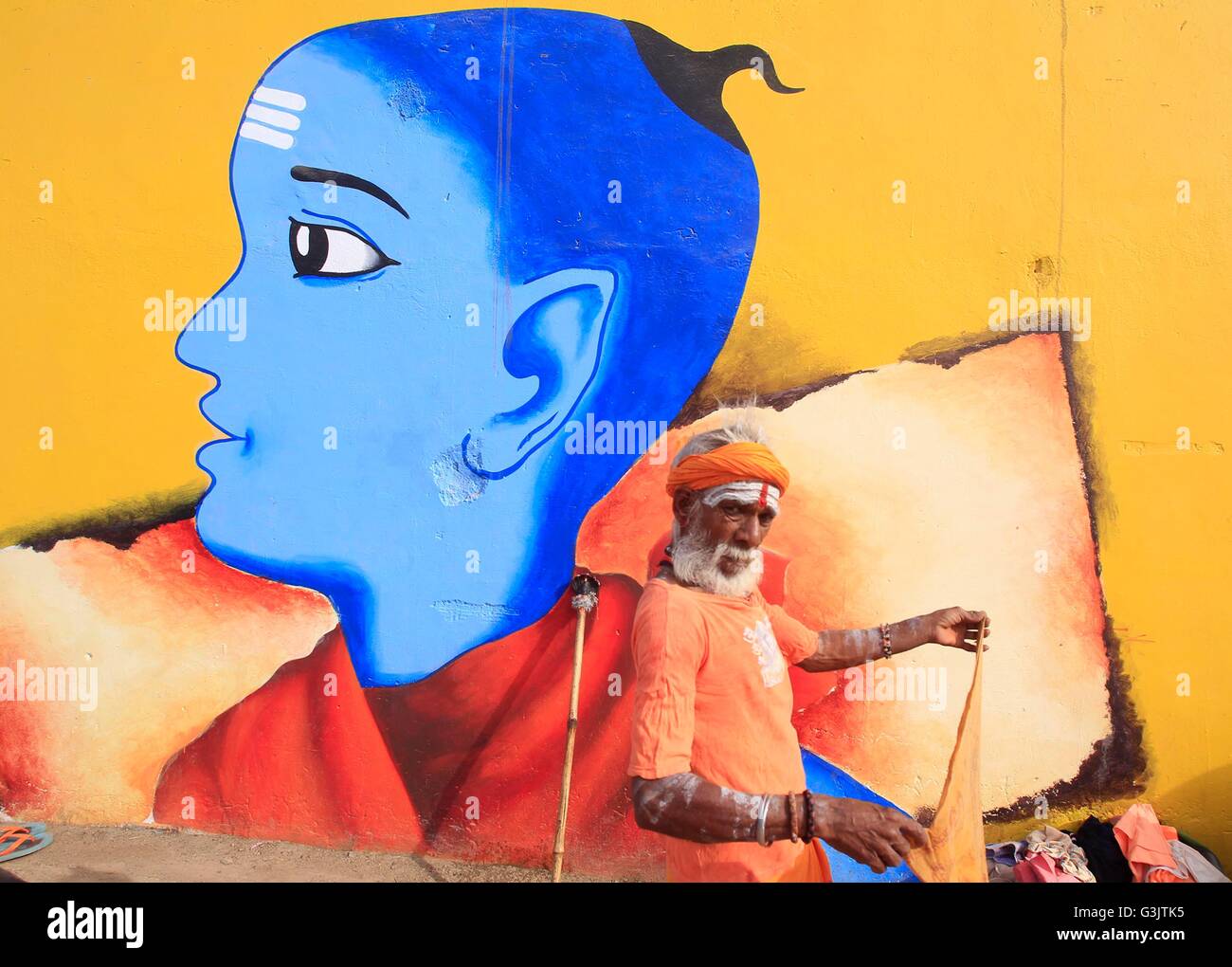 Ujjain, India. 29th Apr, 2016. A Sadhu or holy man change his cloth ...